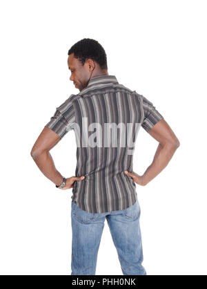 A tall handsome African American man sitting with his fist on his chest ...