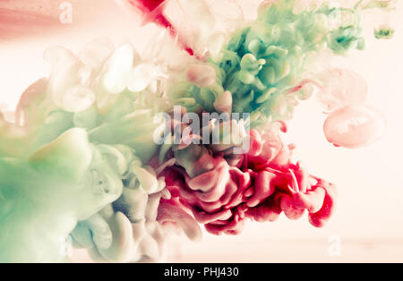 Red, white and green paint splash explosion isolated on white ...