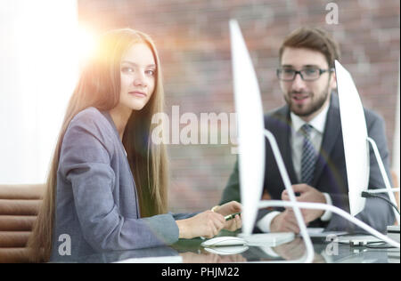 employees of the company discuss working issues standing in the office ...