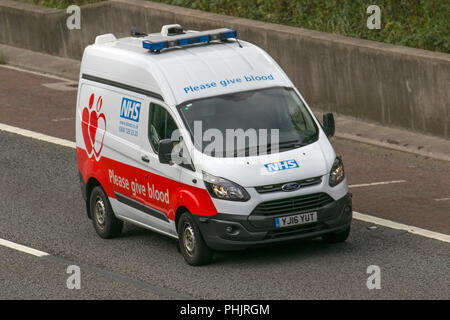 NHS Blood Donor van driving along town centre road supporting ...