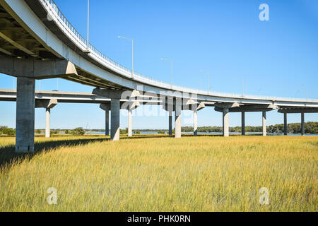 Long raised concrete bridge crossing a marsh Stock Photo - Alamy