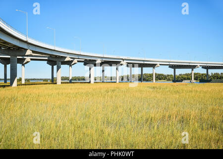 Long raised concrete bridge crossing a marsh Stock Photo - Alamy