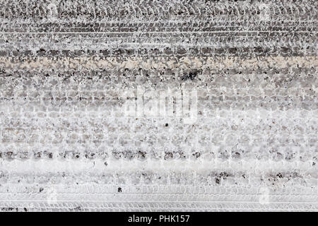 traces of cars in the snow in winter, snow with traces of vehicles on ...