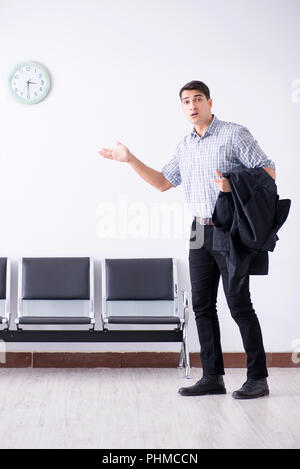 The man nervously impatiently waiting in the lobby Stock Photo - Alamy