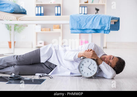 Sleepy doctor tired after long night shift Stock Photo - Alamy