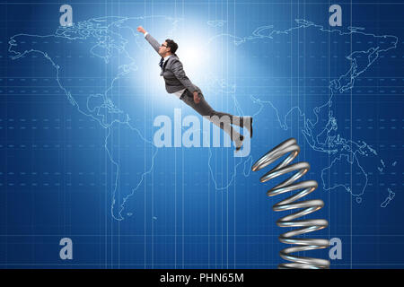 Businessman jumping from spring in business concept Stock Photo - Alamy