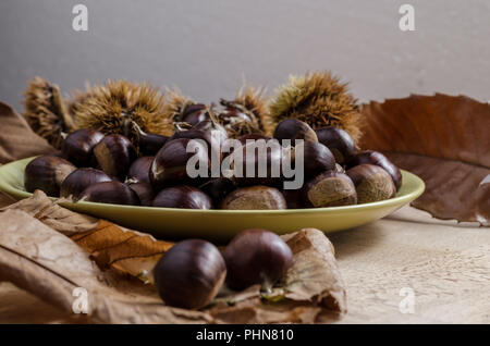a dish full of chestnuts. autumn food Stock Photo - Alamy