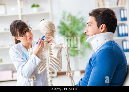 Doctor is explaining to patient with neck injury Stock Photo - Alamy