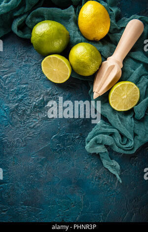 Fresh limes with citrus juicer stick Stock Photo - Alamy