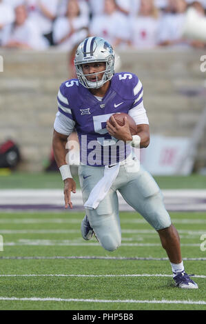Kansas State quarterback Alex Delton (5) gets past Kansas cornerback ...