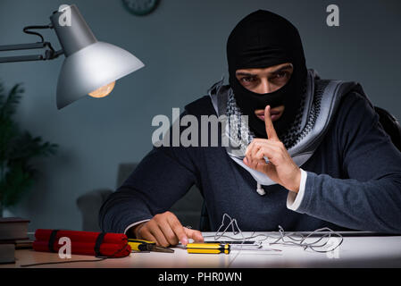 Terrorist bomber preparing dynamite bomb Stock Photo - Alamy