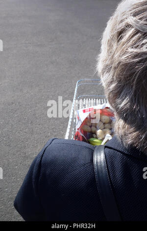 Elderly lady supermarket shopping at Morrisons, Halfway, Sheffield ...