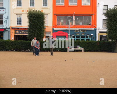 Members of the Liberation Petanque Club playing petanque on a public ...