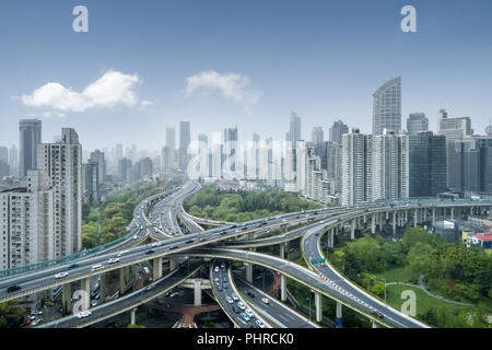 city highway interchange in shanghai on traffic rush hour Stock Photo ...