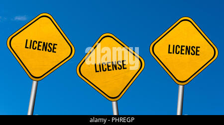 license - yellow signs with blue sky Stock Photo - Alamy