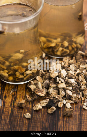 Teaglass with yellowhead root tea Stock Photo - Alamy