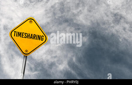 Timesharing, yellow sign with cloudy sky Stock Photo - Alamy