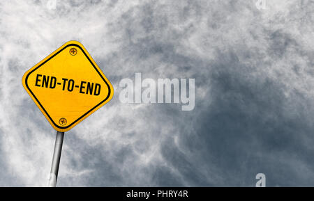 End-to-End - yellow sign with cloudy sky Stock Photo - Alamy
