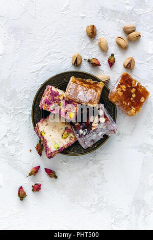 Sweet Turkish delight on a green flat plate Stock Photo - Alamy