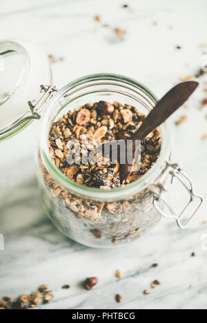 Buckwheat and chocolate granola with hazelnuts in glass jar Stock Photo ...