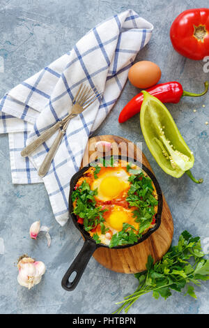 Shakshuka, Fried Eggs with Tomato Sauce and vegetables in Portioned Frying Pan. Tasty Middle ...