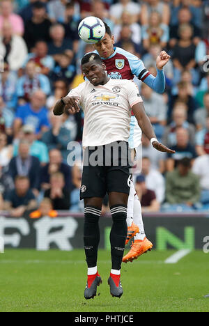 Manchester United's Paul Pogba and Burnley's Ashley Westwood (right ...