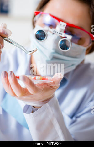 Lab assistant in drug synthesis concept Stock Photo - Alamy