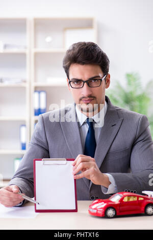 Agent offering car motor insurance Stock Photo - Alamy