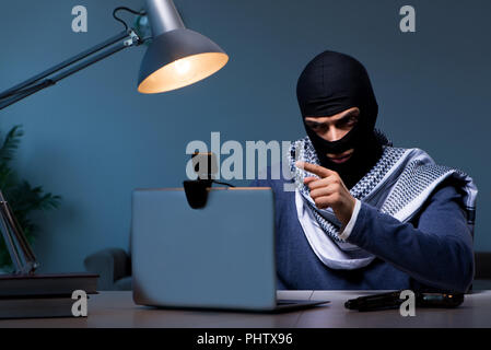 The hacker wearing balaclava mask hacking computer Stock Photo - Alamy