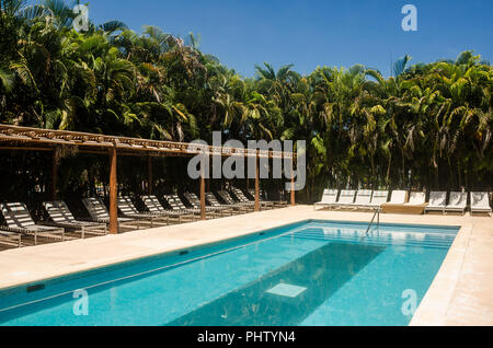VIP swimming pool area of a mexican caribbean resort Stock Photo - Alamy