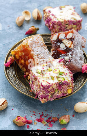Turkish delight with pistachios on grey background. Copy space ...
