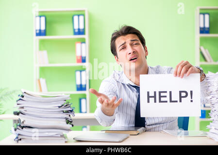 Businessman having problems with paperwork and workload Stock Photo - Alamy