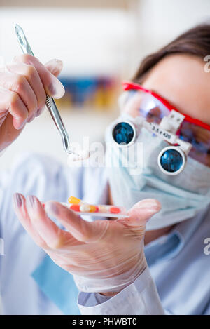 The lab assistant in drug synthesis concept Stock Photo - Alamy