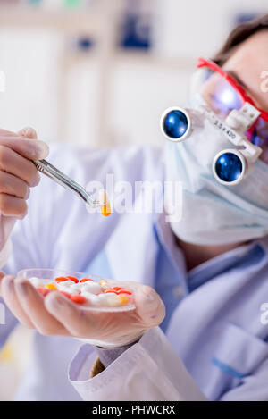 Lab assistant in drug synthesis concept Stock Photo - Alamy