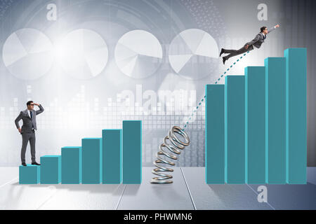 Business people jumping over bar charts Stock Photo - Alamy
