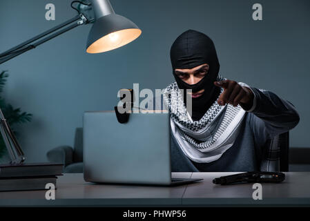 The hacker wearing balaclava mask hacking computer Stock Photo - Alamy