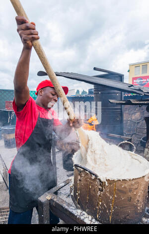 A local Zimbabwean prepares food in a traditional restaurant in Harare ...
