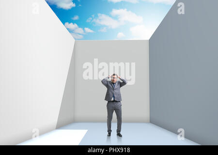Businessman trying to escape from difficult situation Stock Photo - Alamy