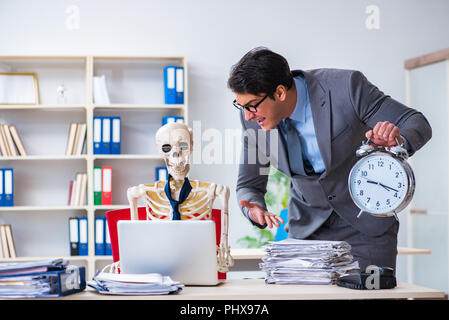The angry boss yelling at his skeleton employee Stock Photo - Alamy