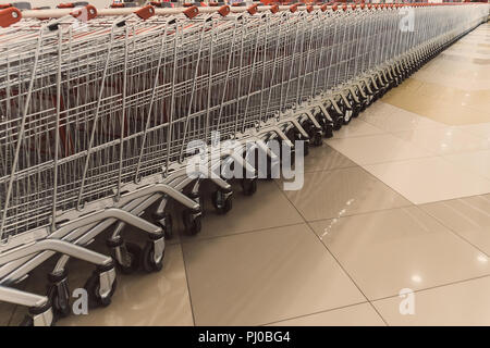 Many shopping carts. Inside a large supermarket. Modern and stylish ...