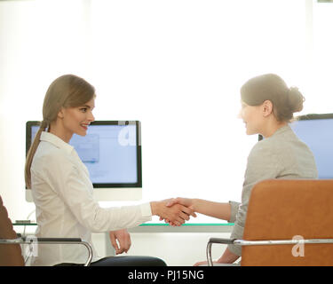 background image. business woman stretches out hand for a handshake ...