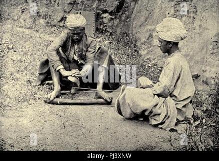 Badagas making fire Stock Photo - Alamy