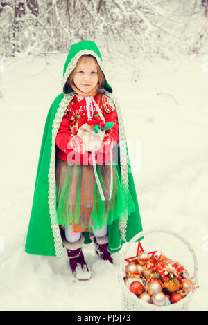 Santa Claus sitting with presents in comfortable chair near fireplace ...