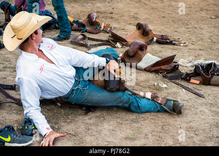 Saddle Bronc cowboy gearing up for Texas rodeo USA Stock Photo - Alamy