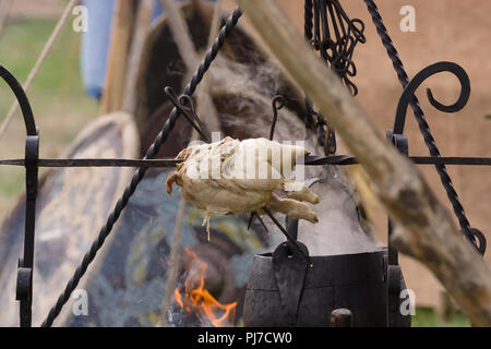 A medieval spit roast Stock Photo - Alamy