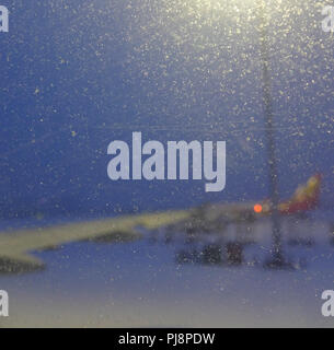 Snow falling, view from airplane window in the bad weather day Stock ...