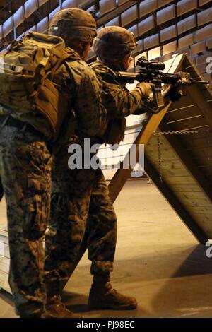 A U.S. Marine with Combat Marksmanship Coach Class 4-22, participates ...