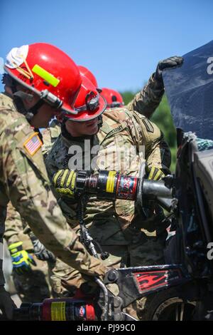 A U.S. Army Soldier conducts a free fall airborne jump out of a CH-47 ...