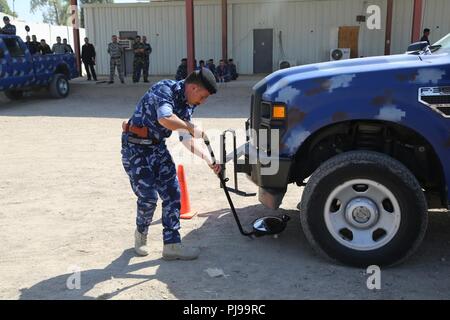 Iraqi police demonstrate vehicle search procedures they learned during ...