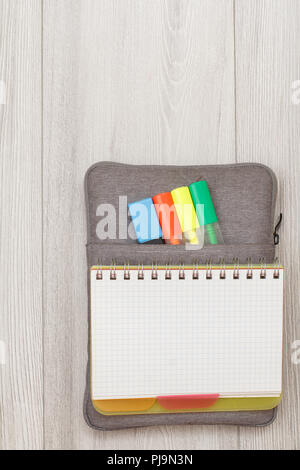 School supplies on wooden boards background. Album, notebooks, felt-tip ...